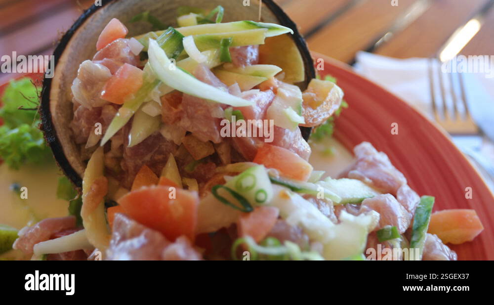 Tahiti local food. Travel food. Typical raw fish dish called Poisson ...