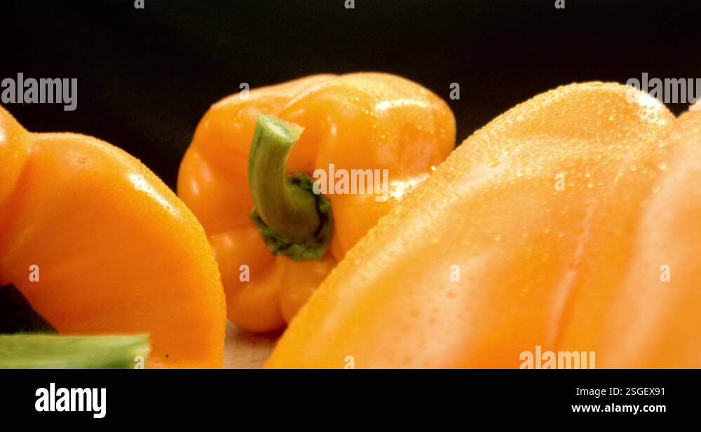 Mature farm yellow pepper in drops of water. Washed clean ripe pepper ...