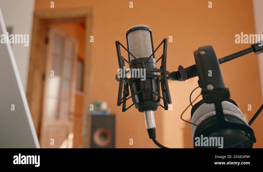 Camera moving towards professional microphone in home recording studio ...