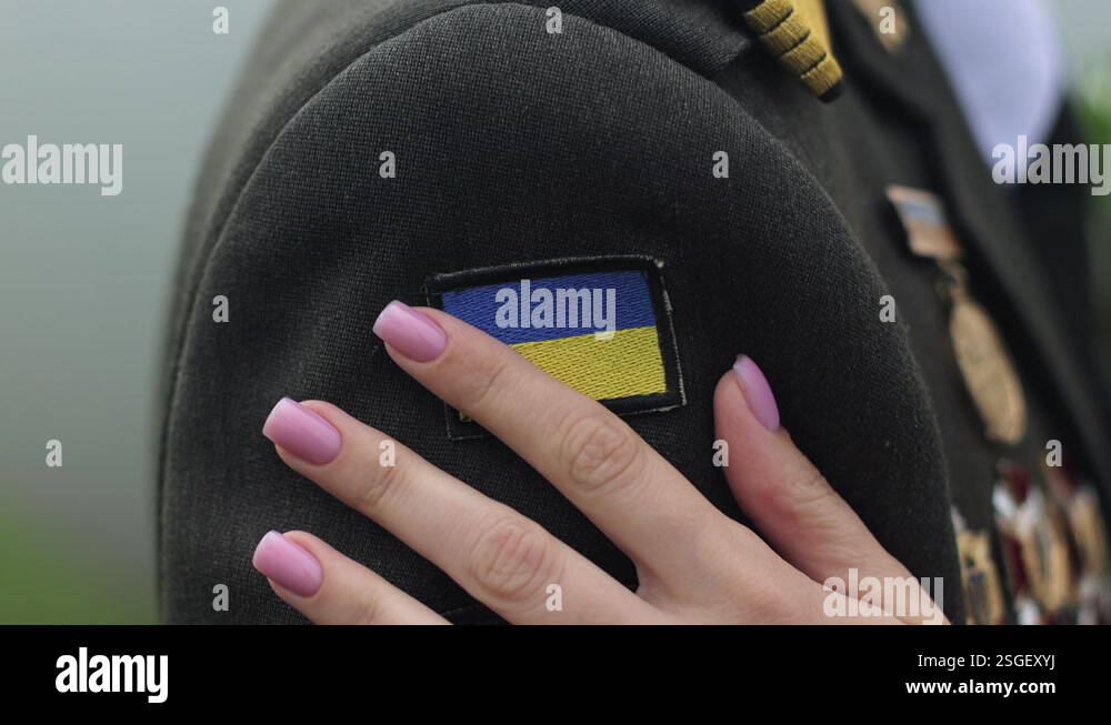 A Ukrainian officer in a suit, a flag on his shoulder Stock Video ...