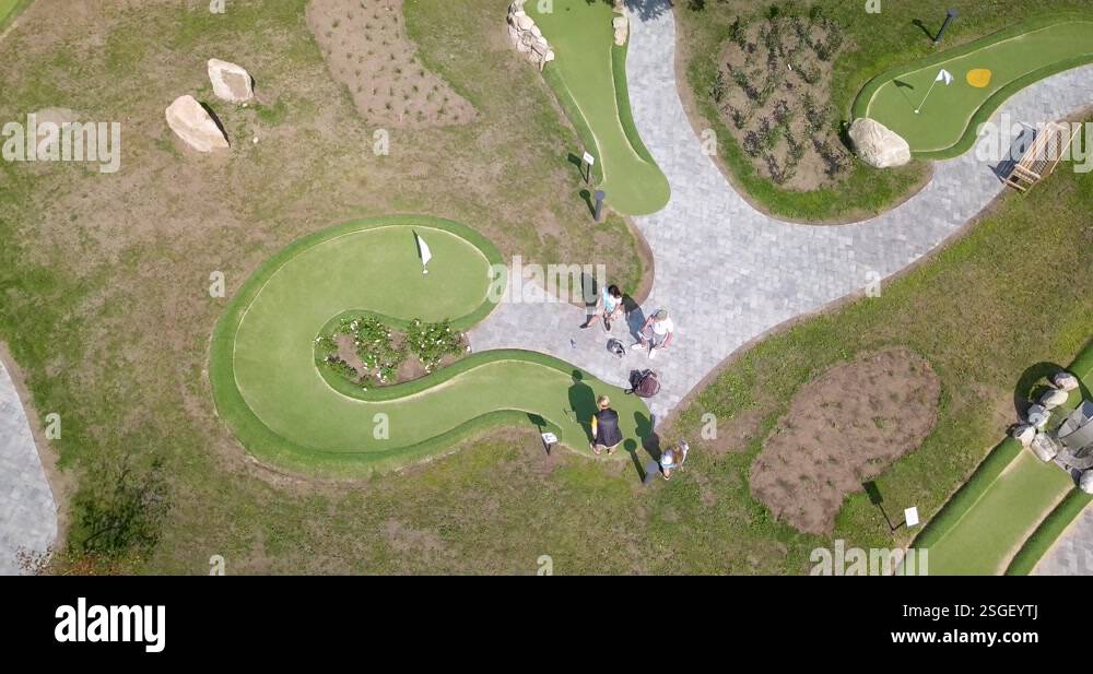 Group of friends playing golf at a resort in the Netherlands ...