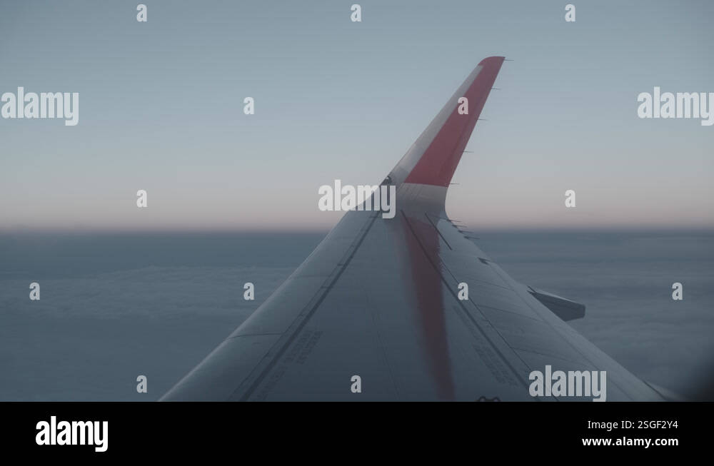 Fly aircraft curved wing in flight above clouds in sky. little ...