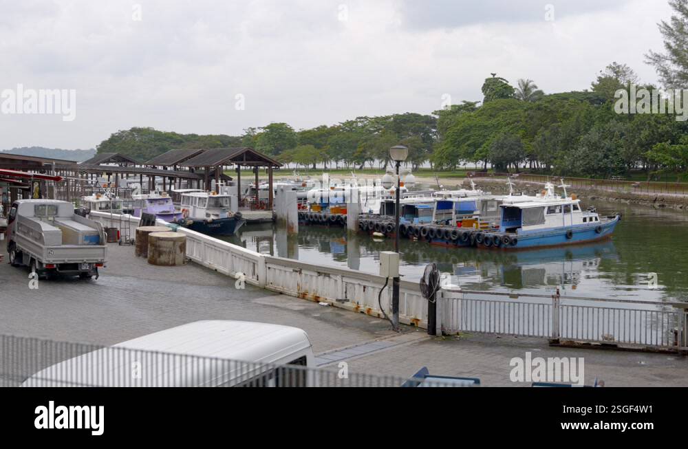 Row Of Bumboats Moored On Water Surface At Changi Jetty In Singapore ...