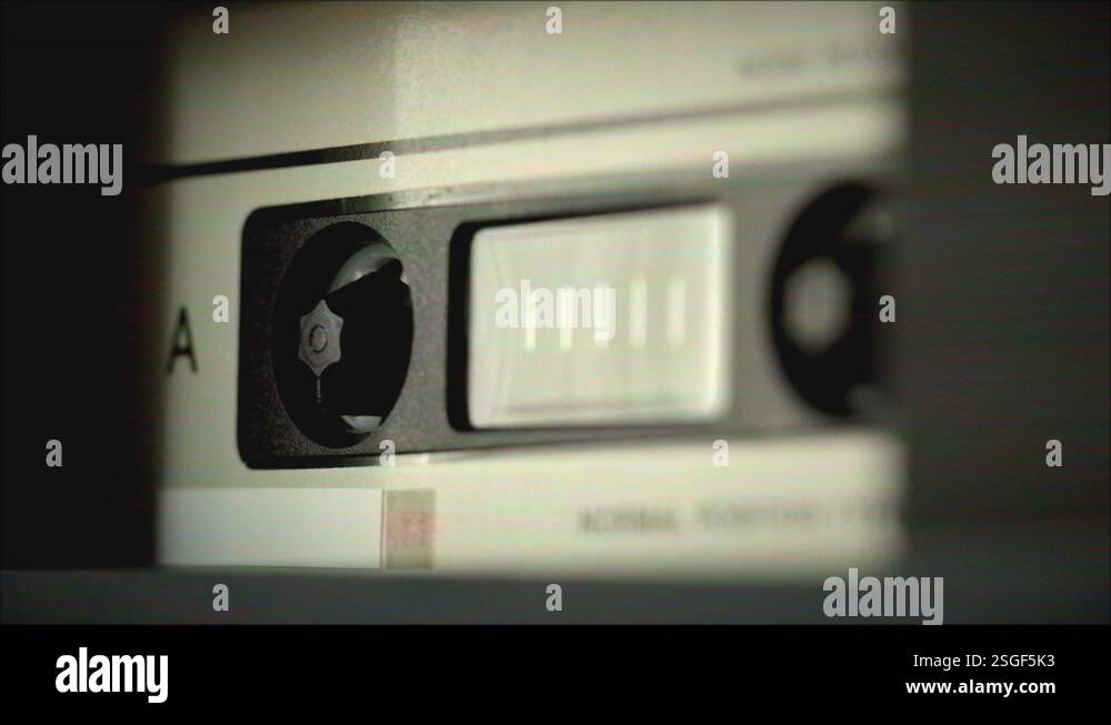 Retro radio tape recorder, audio cassette playing close-up. Listening ...