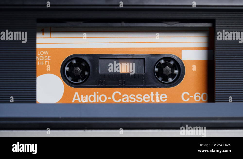 Retro radio tape recorder, audio cassette close-up. Listening to music ...