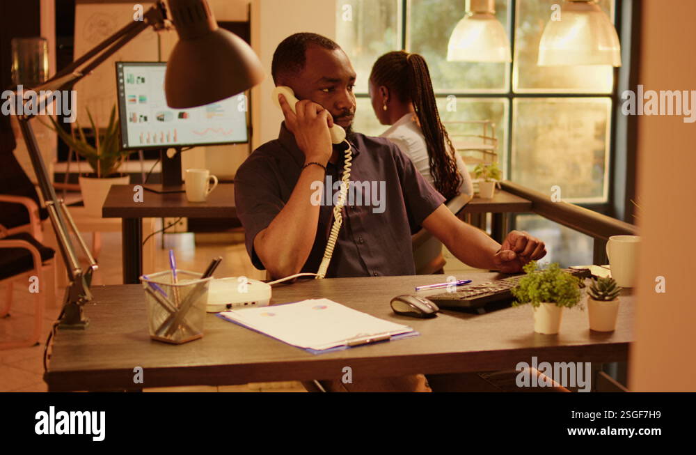 Startup employee using landline phone to chat with people Stock Video ...
