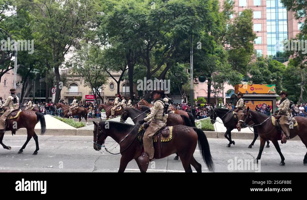 shot of the mounted police parade from the high mountains of mexico ...