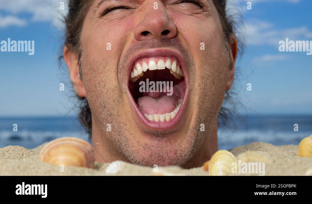 A man buried in sand on beach screaming Stock Video Footage - Alamy