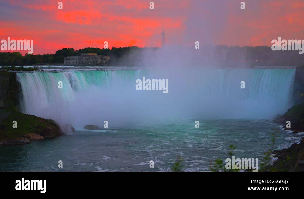 Niagara falls horseshoe in front of power station at Fiery orange sky ...