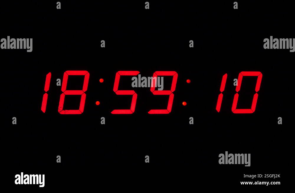 Digital timer on a black background. Light panel with red numbers. 19 o ...
