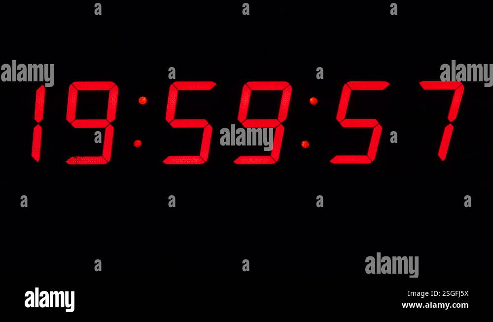 Digital timer on a black background. Light panel with red numbers. 20 o ...