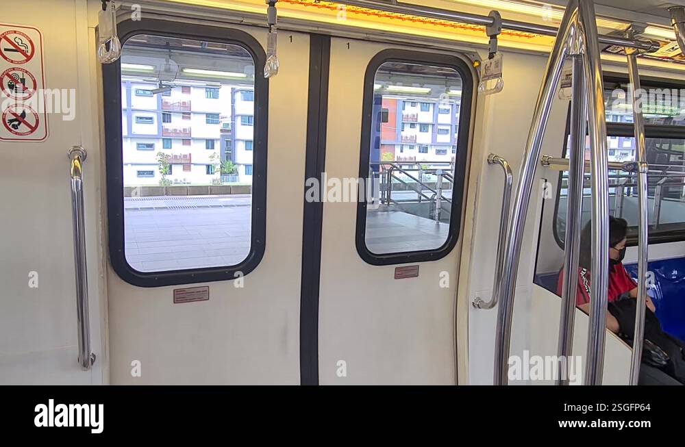Train stopping at a station and its doors opening Stock Video Footage ...
