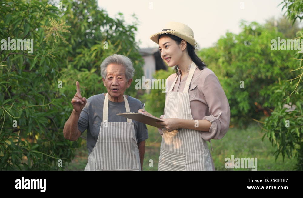 Agricultural concept of 4k Resolution. Aunt teaching her niece to make a gard Stock Video ...