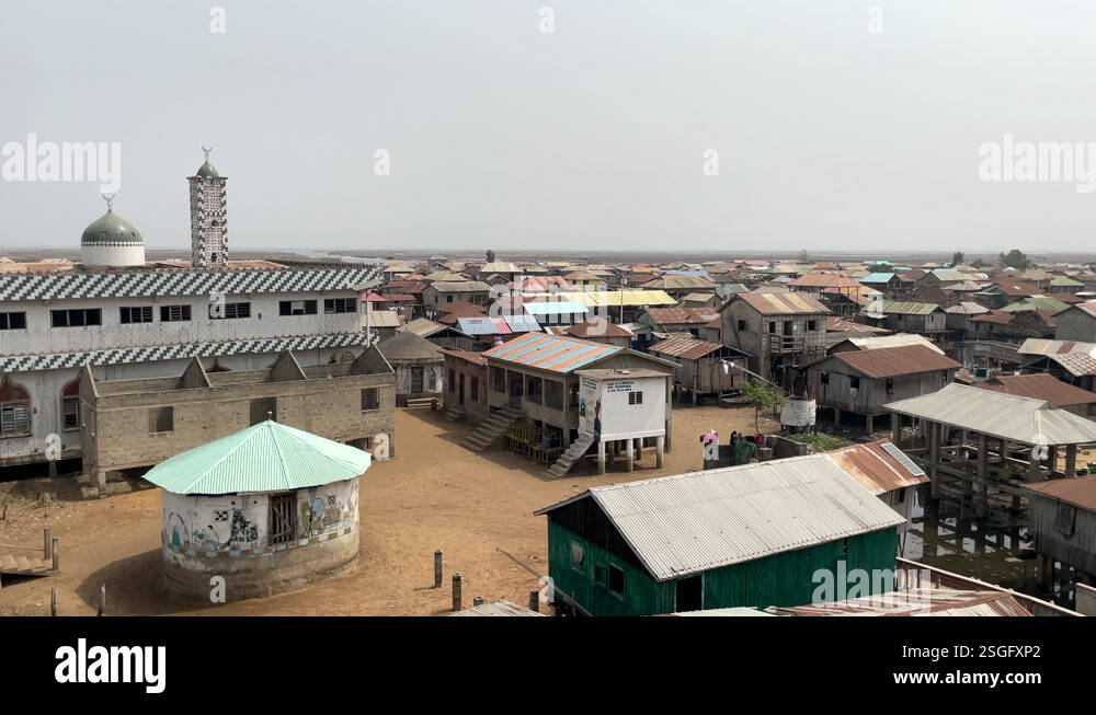 Village buildings of Ganvie in Africa, old poor looking houses, pan ...