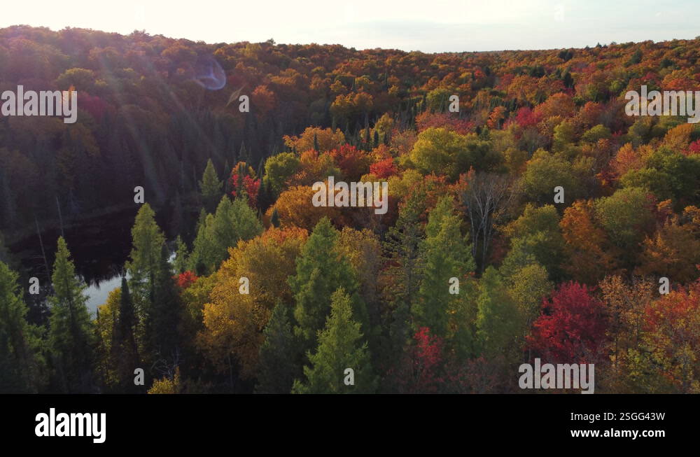 An establishing aerial shot with the golden morning sun rays creating a ...
