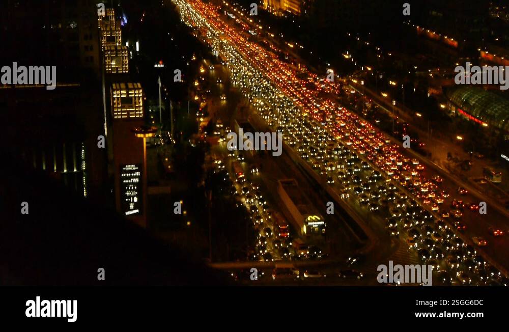 long cars troop on busy overpass,aerial view of night traffic pollution ...