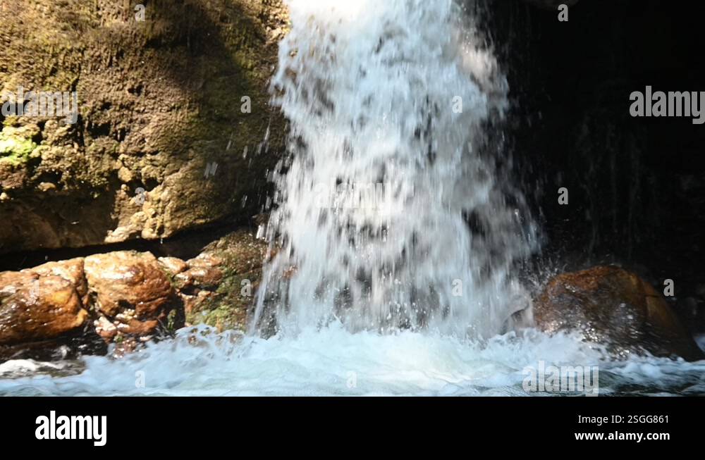 Water falls in front rocks Stock Videos & Footage - HD and 4K Video Clips - Alamy