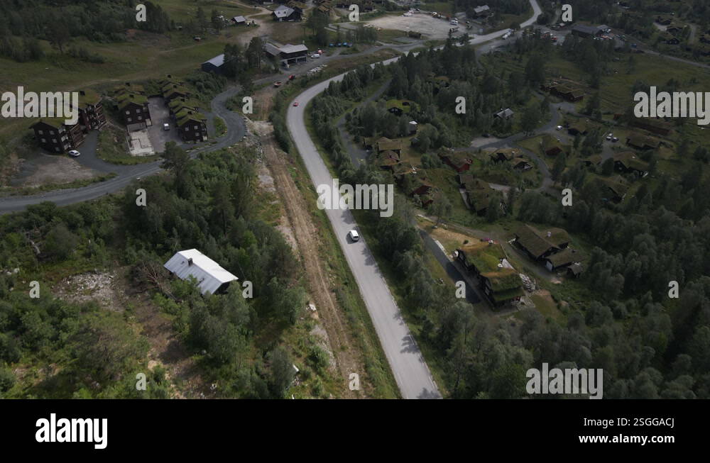 Drone following a car which is driving through the road which is Stock ...