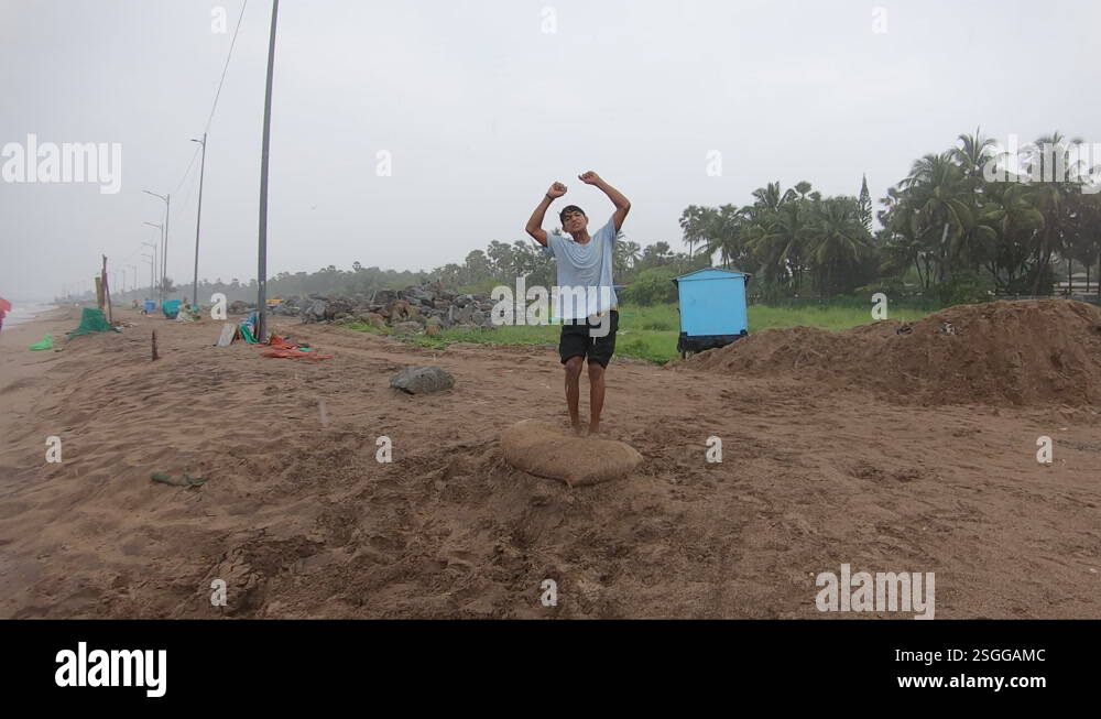 a teenage boy somersaults on the beach. free exercise. 4K videos ...