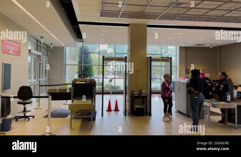 Augusta Ga City Hall interior people and officers at security screening ...