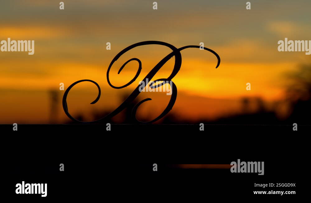 Time Lapse Silhouette Letter B On Gate With Sun Setting In Background ...