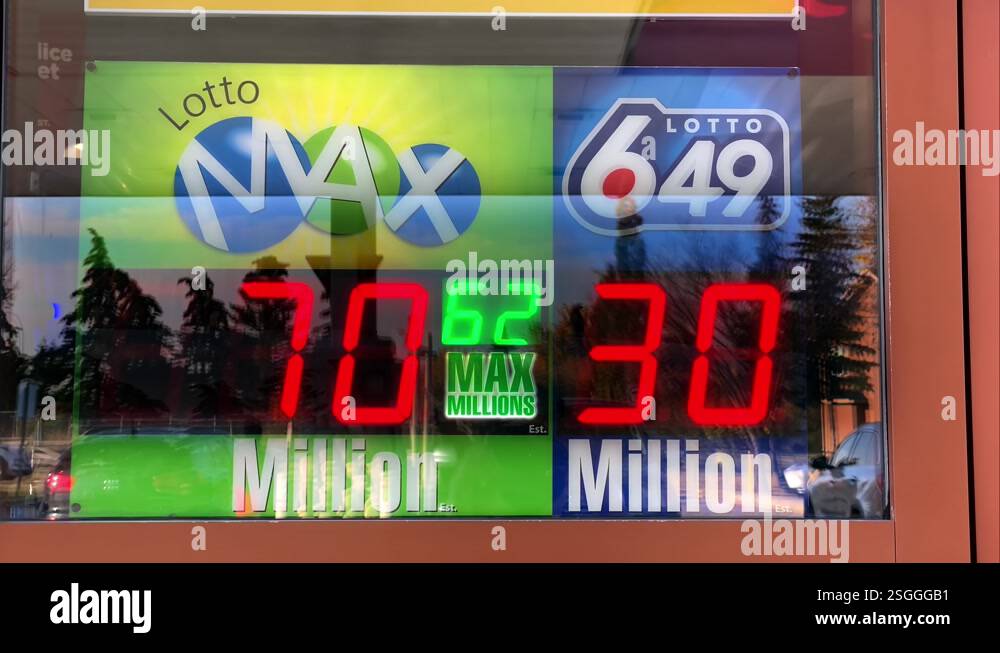 A neon sign lotto Max and lotto 649 on a convenience store's door Stock ...