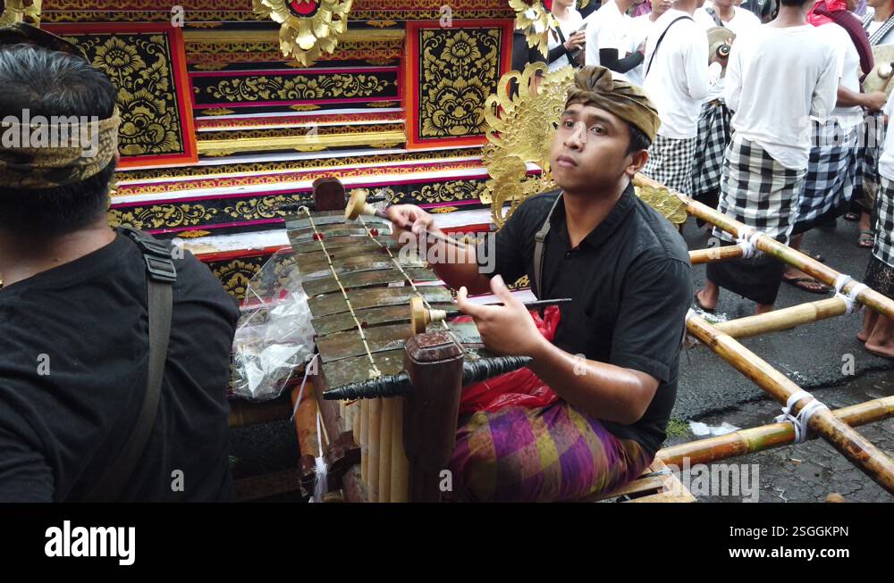Gamelan Player in Bali Indonesia, Playing His Musical Instrument Under ...