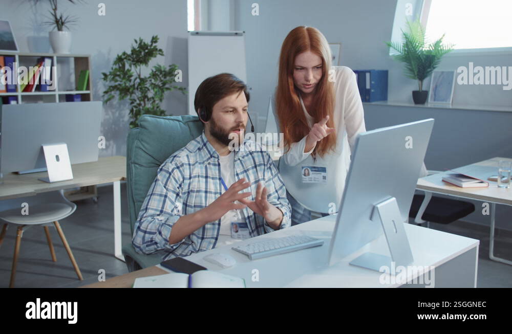 Close up young guy and woman talking smiling using computer and ...