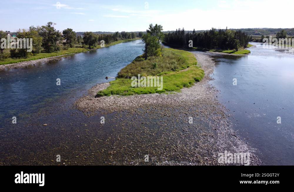 Revealing sun reflections on the mountain river in summer time with ...