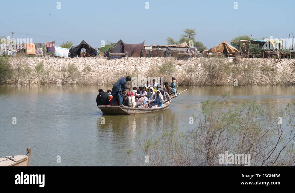 Crowded Boat Full Of Flood Refugees Crossing River In Mahar, Sindh ...