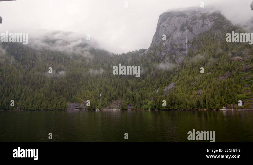 Alaska Misty Fjords, Rudyerd Bay. Wide moving shot of Mist and cloud ...