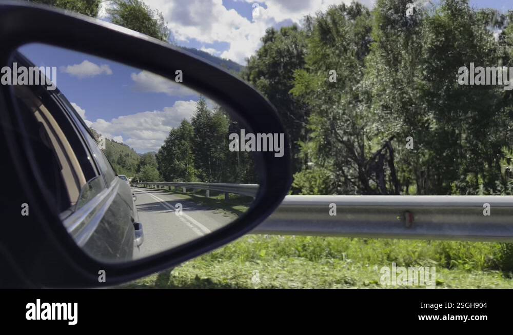 Reflection of the highway in the side mirror of the car Stock Video ...