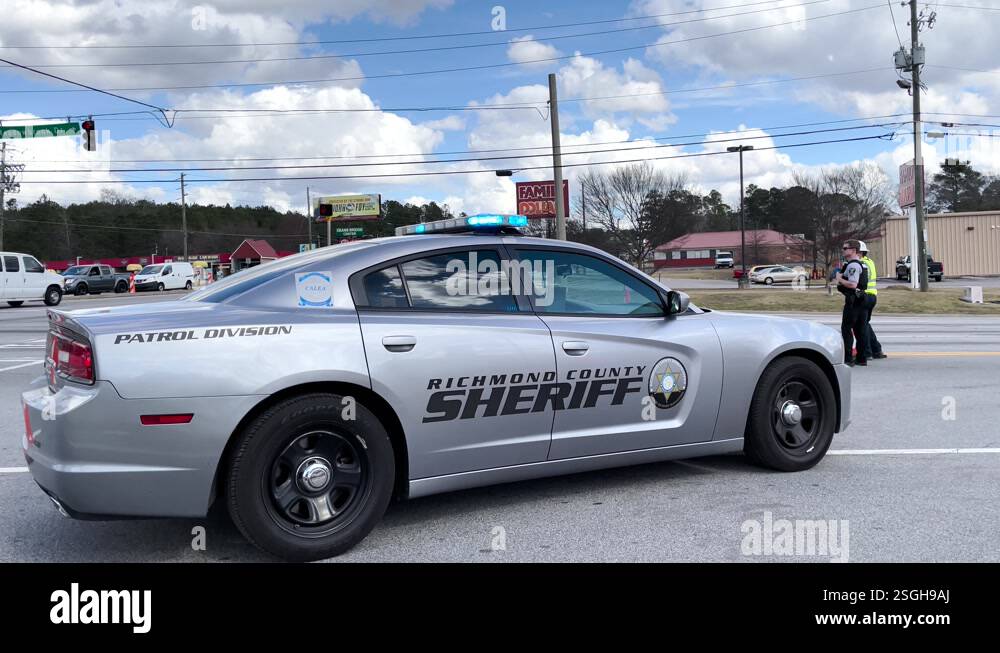 Road repaving construction zone police car and officer flashing lights ...