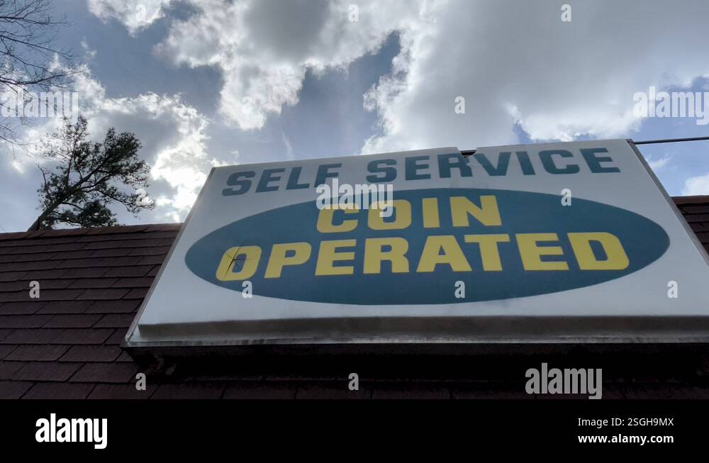 Abandoned dilapidated small old retail strip mall coin operated sign ...