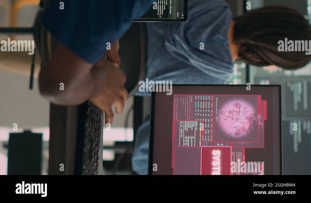 Vertical video: African american it engineer writing code encountering hacking Stock Video ...