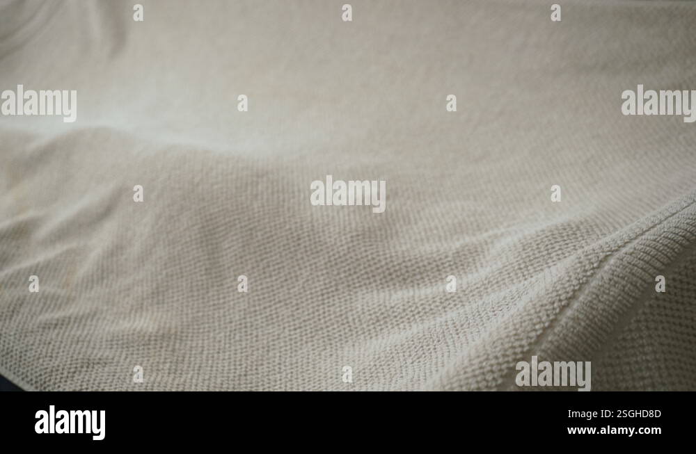 Professional masseur covers woman laying on the table with towel Stock ...