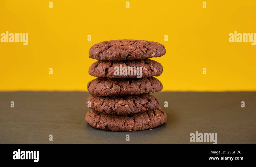 Stack of oatmeal cookies appearing on yellow background. Tasty bakery ...