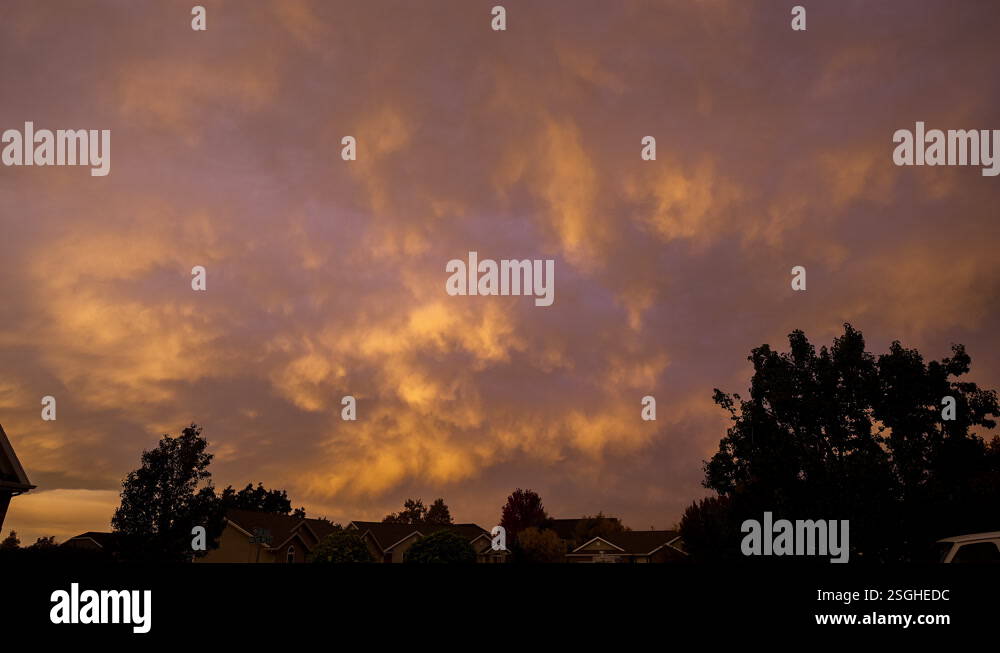 Timelapse during sunrise over Utah Valley as clouds move over houses ...