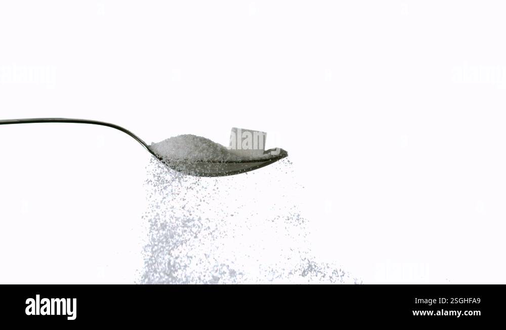 Sugar spilling off spoon with sugar and sugar cube Stock Video Footage ...