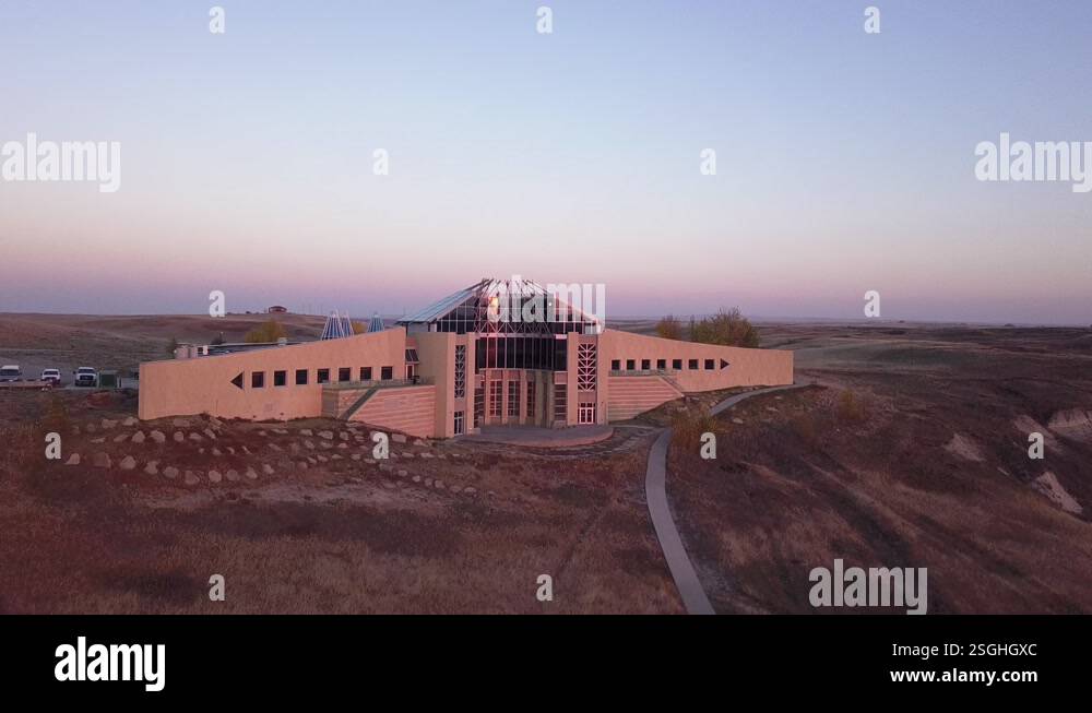Sunset reflects in windows: Prairie hillside Siksika Blackfoot centre ...