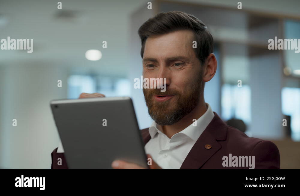 Excited man receiving message at modern lobby closeup. Person winning ...