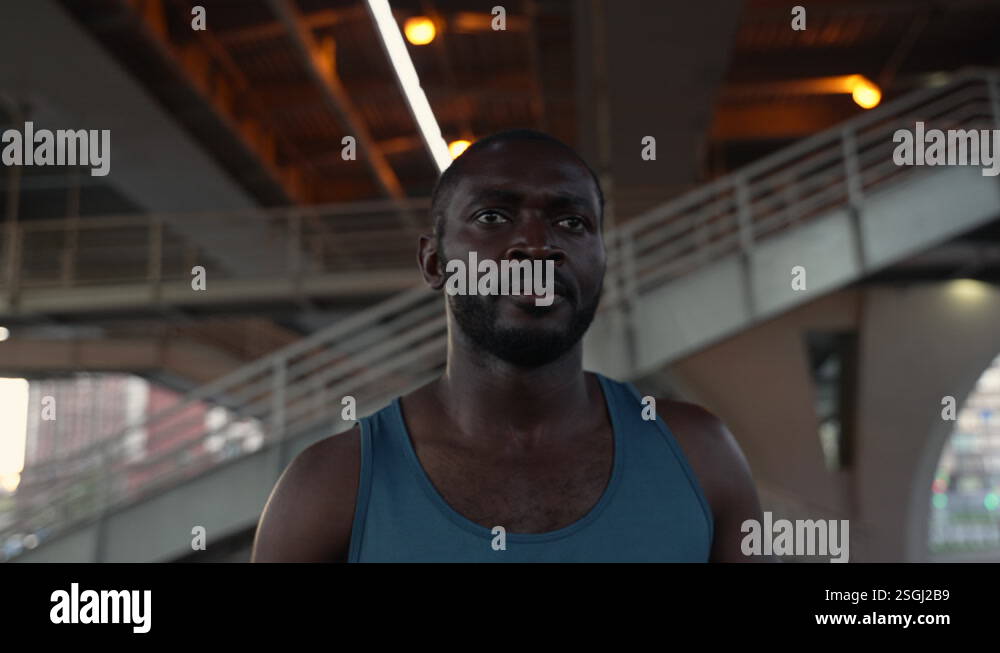 4k Male athlete does cardio and jumps in city outdoors spbas Stock ...