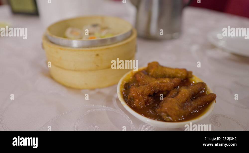 Braised chicken claws in basket at Chinese restaurant Stock Video ...