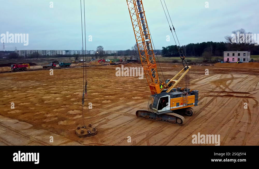Dynamic Soil Compaction With Mobile Crane And Tamper Weight. aerial ...