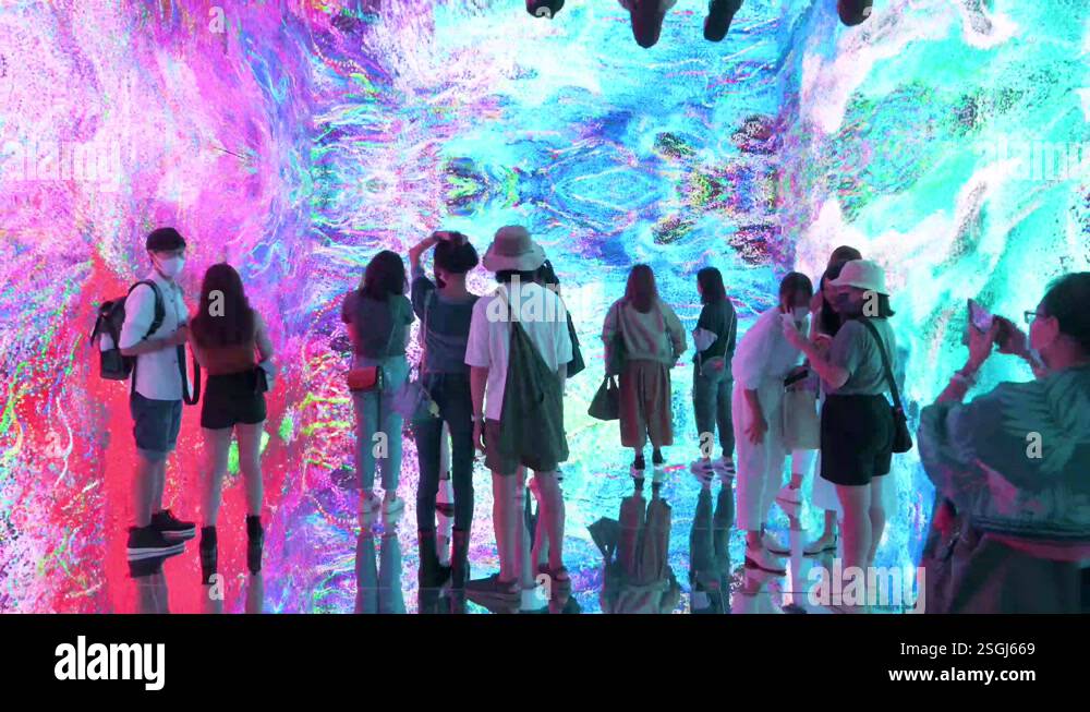 People visit an immersive futuristic art installation inspired by new ...