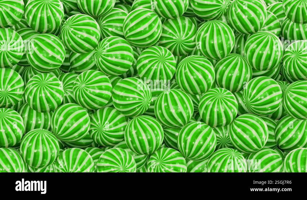 Striped watermelon flavor green and white candies filling up the screen ...