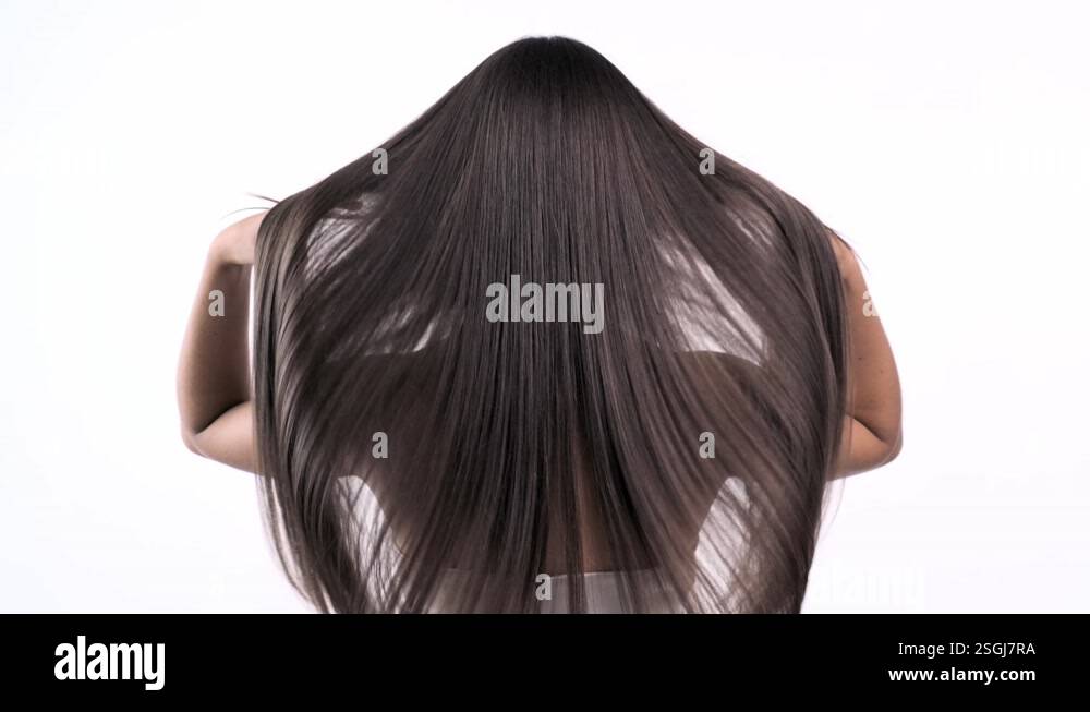 Woman moves long hair. Rear view. Girl shakes long straight hair ...
