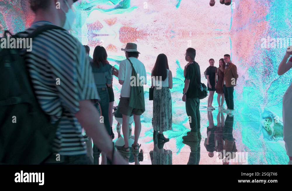 People visit and take photos of an immersive futuristic art ...
