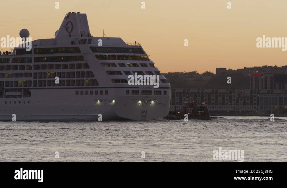 Stern View Of Passenger Cruise Ship Being Assisted By Tug Boat Along ...