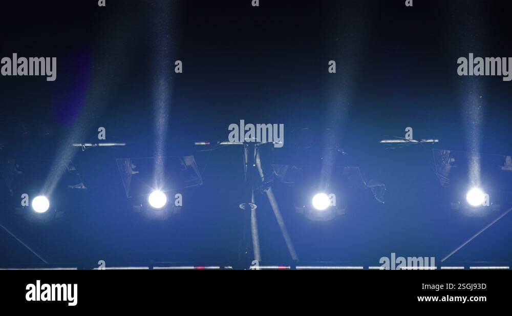 flashing and rotating light beams from stage lights on a construction ...